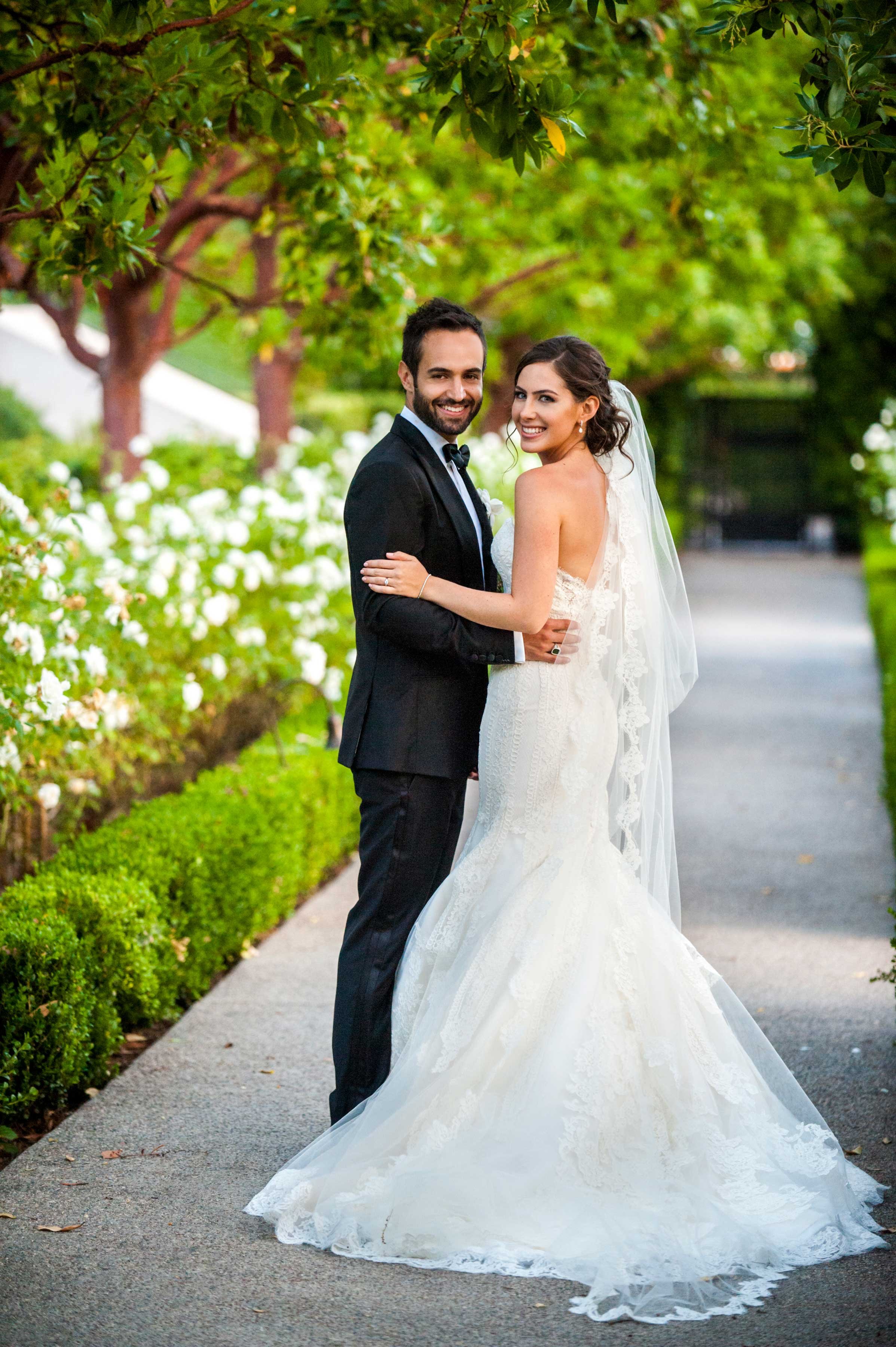 Couple Looks Over Shoulders in Pose