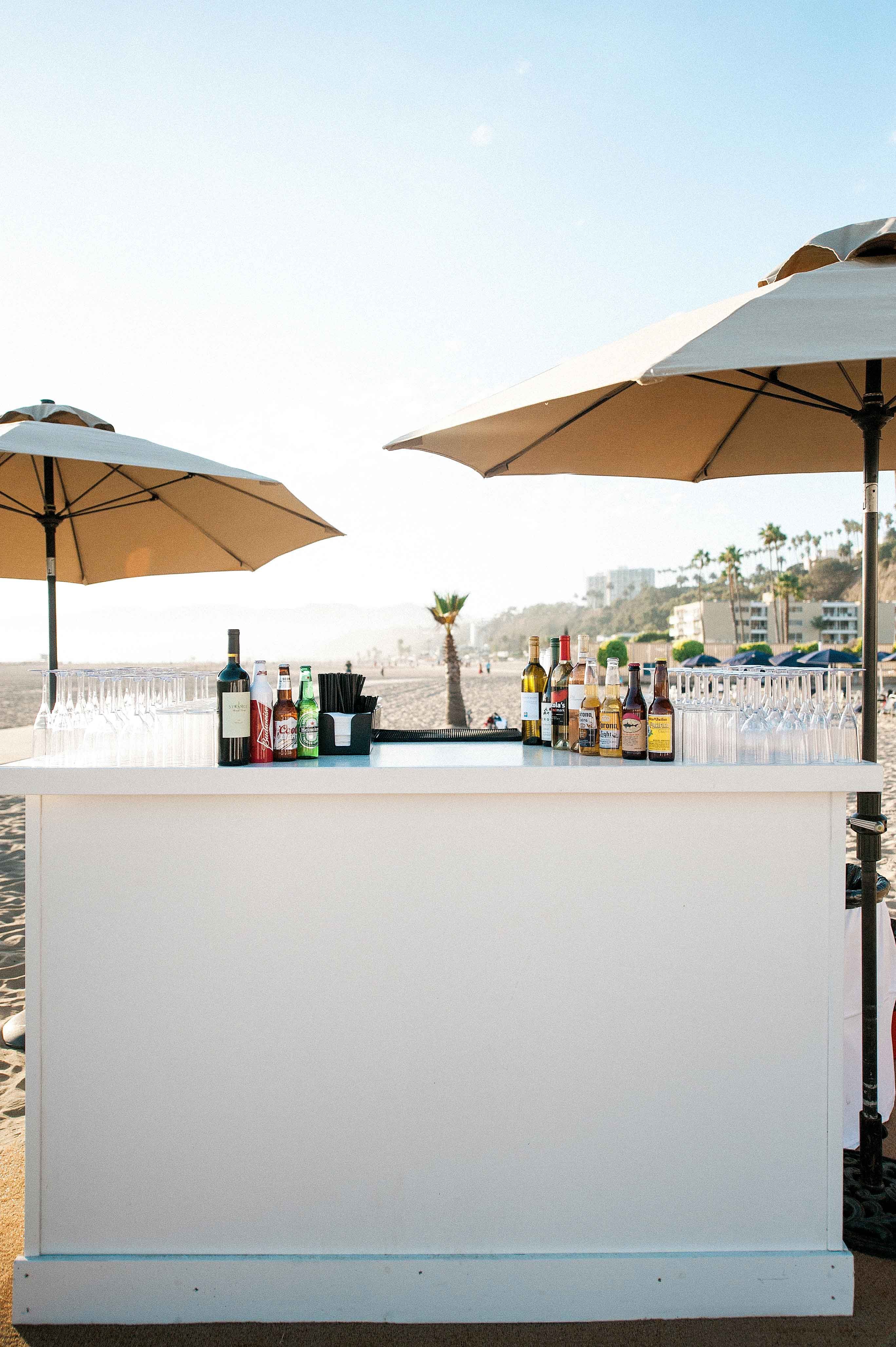 Beachside Cocktail Hour Bar Under Umbrellas
