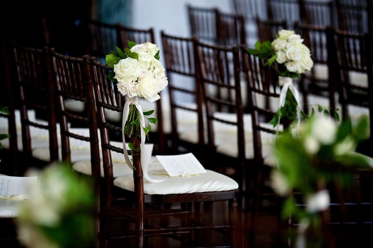 Posies of Ivory Roses on Chairs