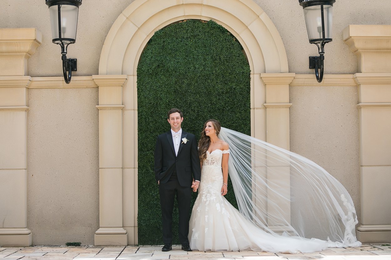 Bride and Groom in Front of Hedge