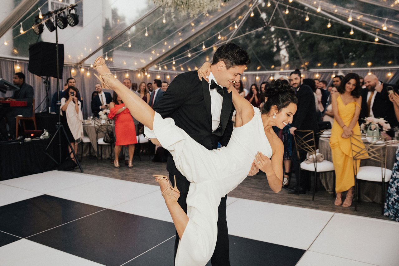 Bride & Groom Doing Lift on Dance Floor