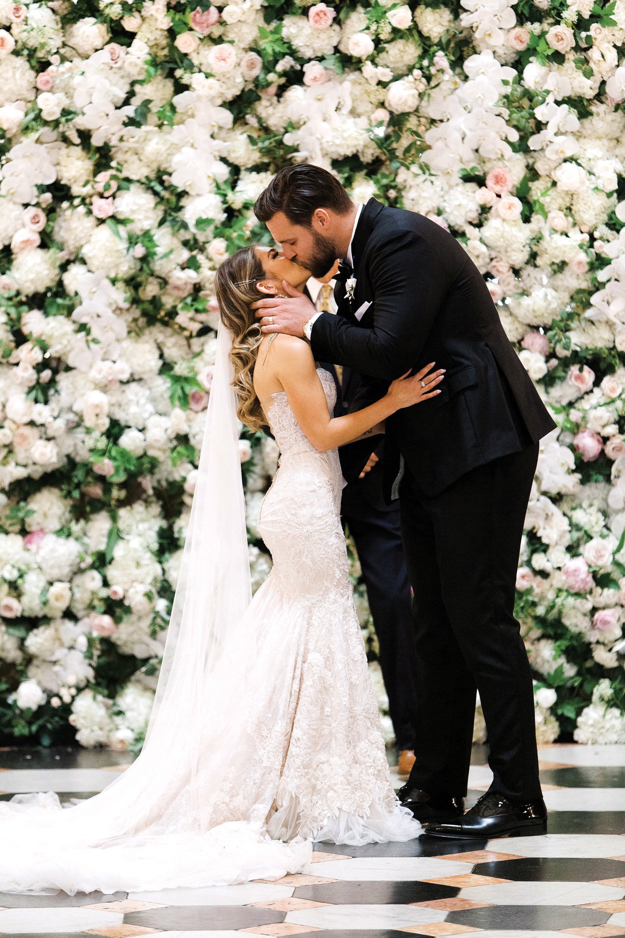 Groom Bends Down to Kiss Bride